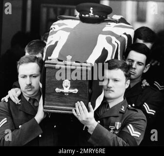 The coffin is carried from the church after the funeral of Andrew ...