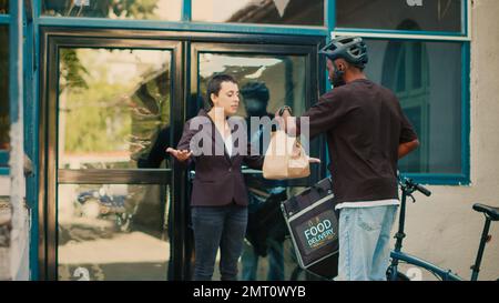 Angry man client of restaurant yelling at young waitress Stock Photo ...
