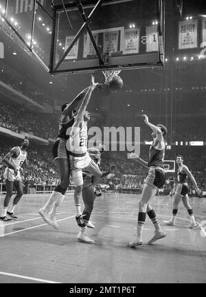 Boston Celtics Larry Siegfried, (20), overruns ball in scramble with ...
