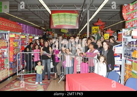 Pop singer Miley Cyrus poses in a fashionable high waist mini skirt and ...