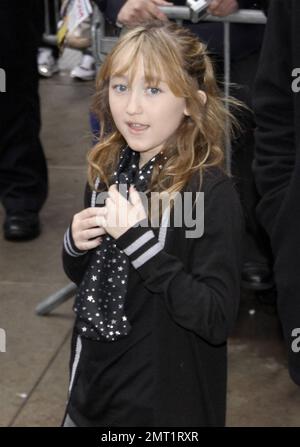 Miley Cyrus brings along a Starbuck's coffee as she arrives with sister ...