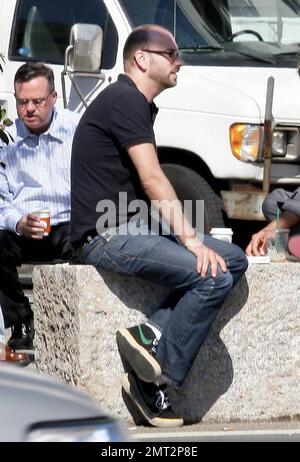 Exclusive!! Moby takes a meeting with a friend sitting on a wall in ...