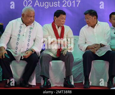 Executive Secretary Salvador Medialdea, right, delivers his speech ...