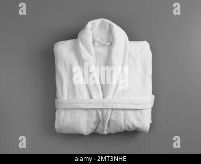 Folded bathrobe on color background Stock Photo - Alamy