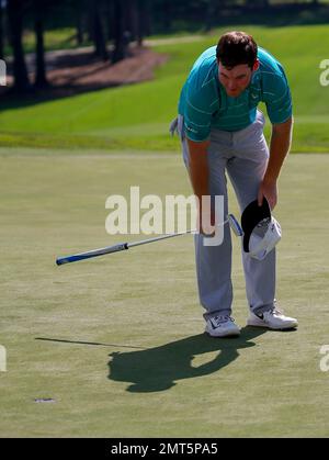 Grayson Murray reacts after making a putt on the 18th green and winning ...
