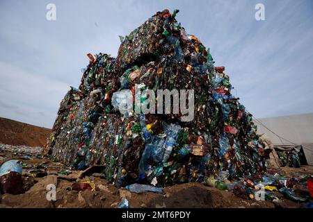 Bales of compacted hard plastic waste awaiting collection for recycling ...