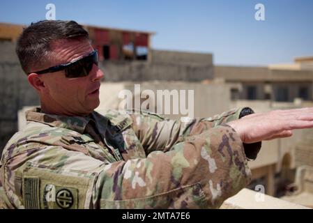 Colonel Pat Work of the U.S. Army's 82nd airborne division looks at the ...