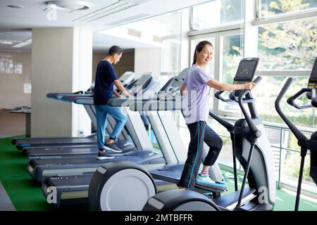 Japanese senior couple training at indoor gym Stock Photo - Alamy