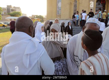 Iraqi Sunni Muslims exchange greetings after Eid al-Adha prayers ...