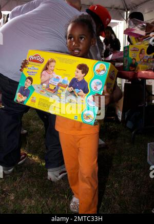 Rapper Pitbull attends his annual Christmas toy giveaway, signing ...