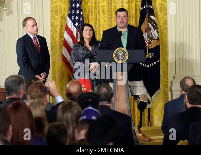 Sergeant Michael Verardo (right) speaks with his wife Sarah Verardo at ...