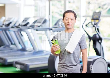 Japanese man training at indoor gym Stock Photo - Alamy