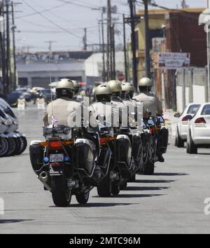 Police form a motorcade with their bikes, complete with mini Union Jack ...