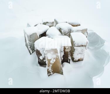 ice block covered river in winter with sandstone cliffs Stock Photo - Alamy