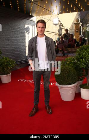 Hugh Skinner poses for photographers upon arrival at the World premiere ...