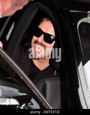 Actor and comedian Ricky Gervais is all smiles as he poses for photos ...