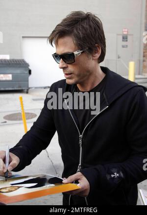 Rob Lowe signs autographs as he arrives at the "Jimmy Kimmel Live ...