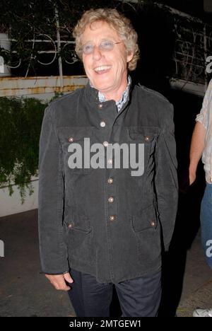 The Who frontman Roger Daltrey poses for photos with fans as he leaves ...