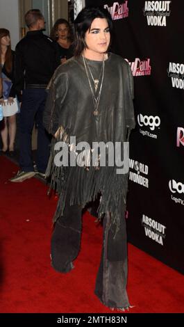 In a leather fringe poncho, leather bellbottoms and blue eye makeup ...