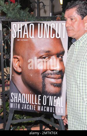 Shaquille O'Neal signs copies of his new book "Shaq Uncut" at Books and ...