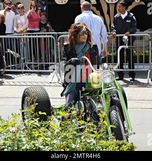 Steven Tyler arrives on a custom motorcycle tricycle at the press ...