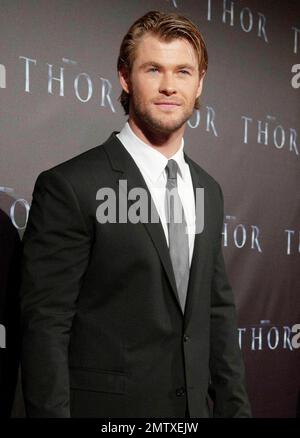 Actor Chris Hemsworth poses for photographers on arrival at the 'GQ Men ...