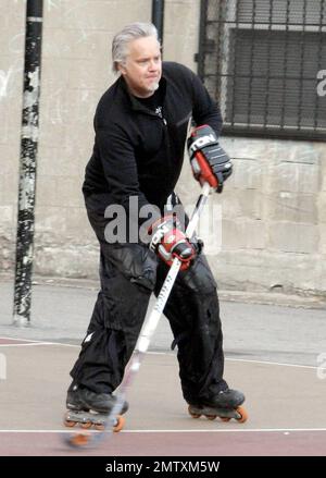 Actor Tim Robbins gets in a game of roller hockey with a group of ...