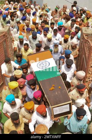 Pakistani army soldiers carry coffin of their colleagues, Tuesday, July ...
