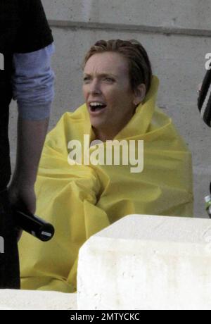 EXCLUSIVE!! Toni Collette covers up with a yellow tarp as she has some ...