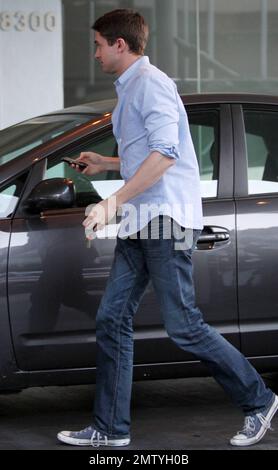 EXCLUSIVE!! Topher Grace leaves an LA hotel with what appears to be a ...