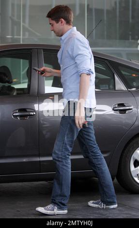 EXCLUSIVE!! Topher Grace leaves an LA hotel with what appears to be a ...
