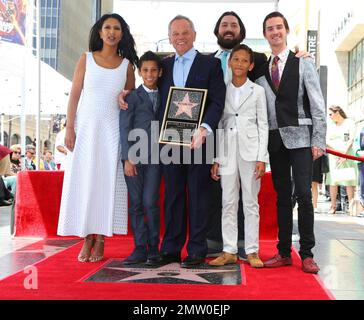 Chef Wolfgang Puck poses with his wife Gelila Assefa and his sons ...