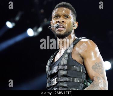 With sweat pouring from his face and clad in a buckle-detailed vest ...