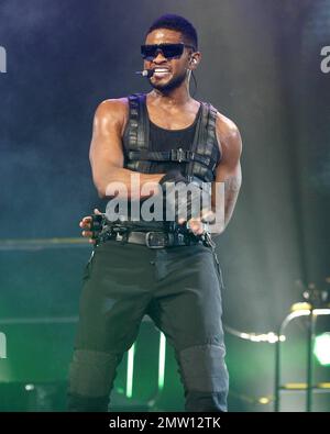 With sweat pouring from his face and clad in a buckle-detailed vest ...