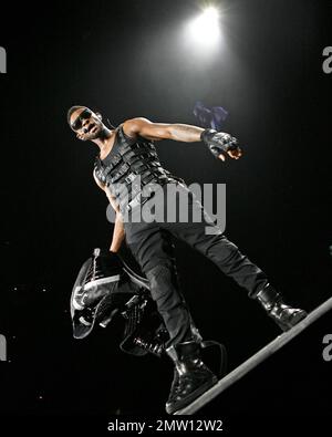With sweat pouring from his face and clad in a buckle-detailed vest ...