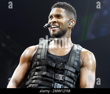 With sweat pouring from his face and clad in a buckle-detailed vest ...