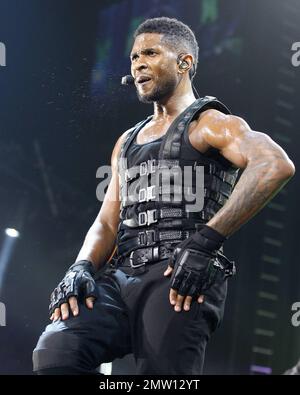 With sweat pouring from his face and clad in a buckle-detailed vest ...