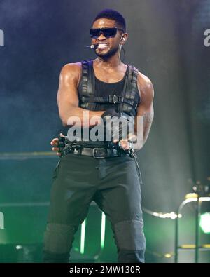 With sweat pouring from his face and clad in a buckle-detailed vest ...