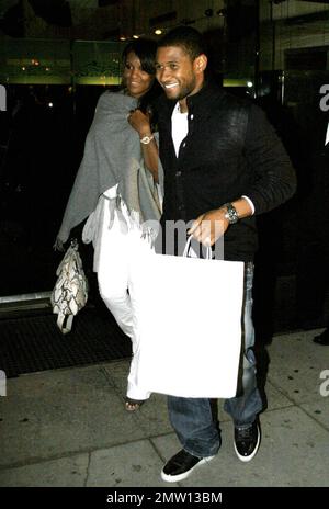Usher and his wife Tameka Foster are all smiles as they leave the ...