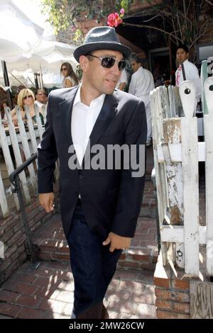 Vinnie Jones looks dapper in a hat, shades and blazer as he leaves The ...