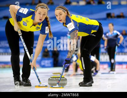 Sweden's Agnes Knochenhauer, left, and Sofia Mabergs, celebrate after winning the women's ...