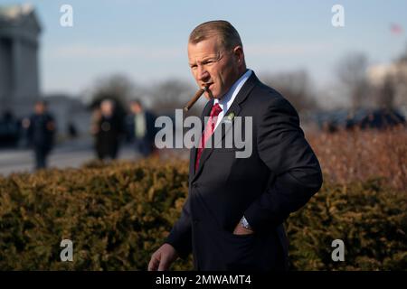 Rep. Troy Nehls (R-Texas) smokes a cigar as he departs a vote at the U ...