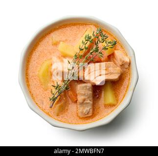 bowl of salmon and tomato soup on white kitchen table Stock Photo - Alamy