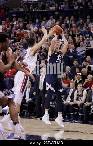 BYU forward Eric Mika (12) dribbles the ball while defended by Gonzaga ...