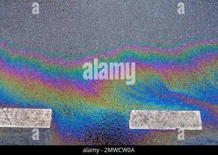 Environmentally harmful traces of oil on an asphalt road, Berlin ...