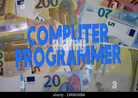 Computer Programmer word with money. Paper currency background with ...