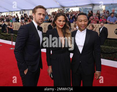 Ryan Gosling, from left, Chrissy Teigen and John Legend arrive at the ...