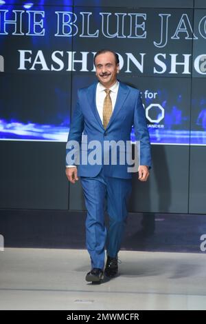 Dr. Ash Tewari walks the runway wearing Huntsman during the Seventh ...