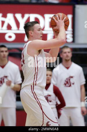 Washington State forward Josh Hawkinson (24) pulls down a rebound as ...