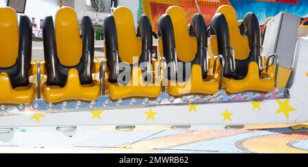 The Empty Seats of a Fast Spinning Fun Fair Ride Stock Photo - Alamy